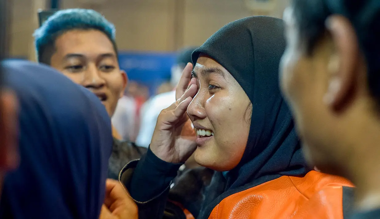 Aksi dan Ekspresi Peraih Medali Emas Peparnas XVII - Foto Liputan6.com