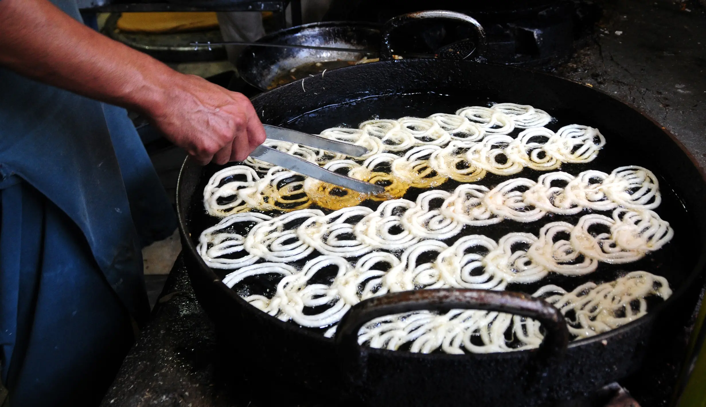 FOTO: Tradisi Penganan Manis Idul Fitri di Pakistan - Foto Liputan6.com