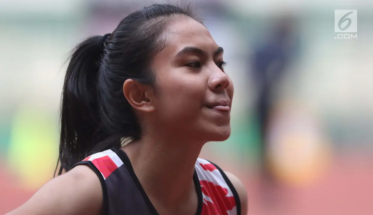 FOTO: Pelari DKI Jakarta Jeany Nurainy Raih Emas 100 Meter Putri U-20 - Foto Liputan6.com