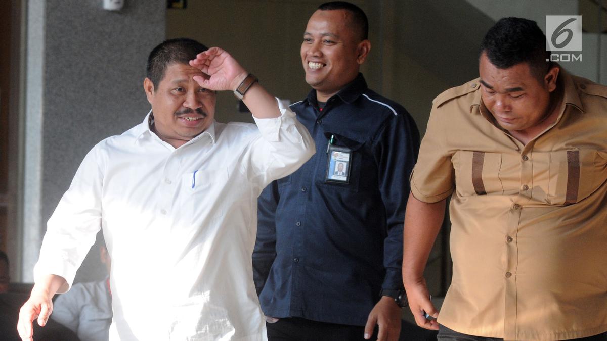 FOTO: Ekspresi Bupati Bengkalis Usai Jalani Pemeriksaan di KPK - Foto Liputan6.com