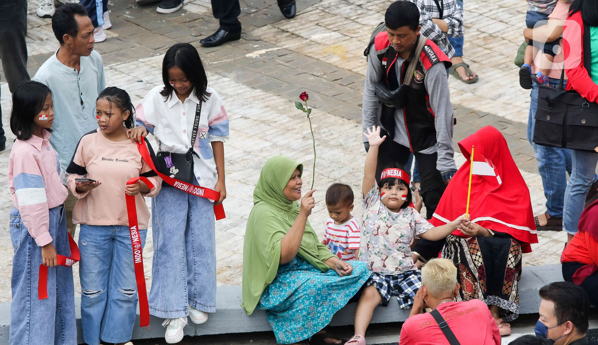 Ragam Cara Warga Sambut Arak-arakan Timnas Indonesia - Foto Liputan6.com