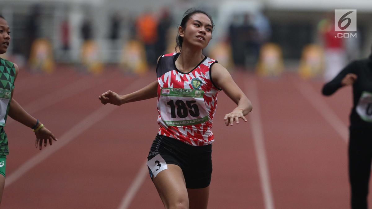 FOTO: Pelari DKI Jakarta Jeany Nurainy Raih Emas 100 Meter Putri U-20 - Foto Liputan6.com