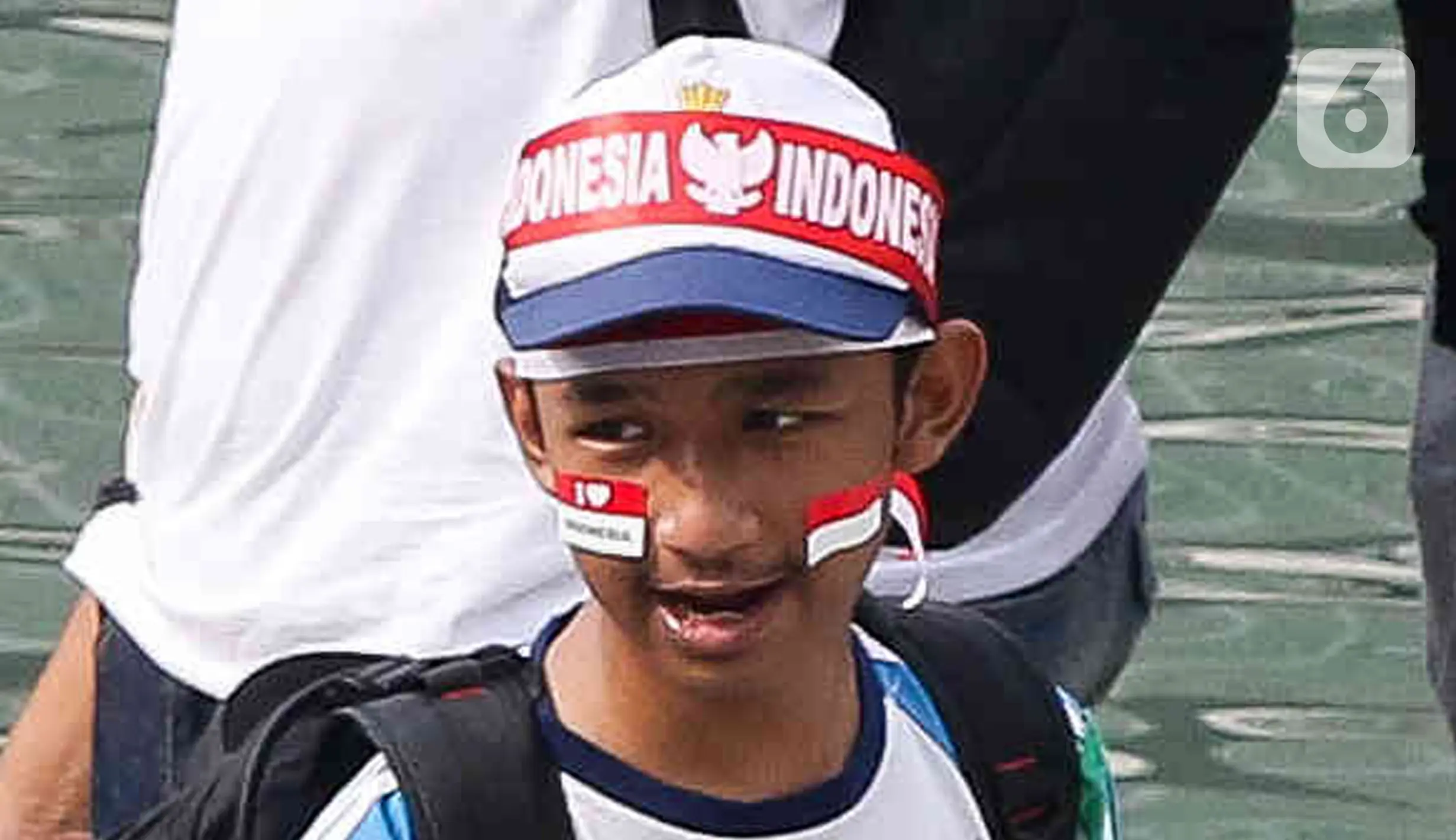 Ragam Cara Warga Sambut Arak-arakan Timnas Indonesia - Foto Liputan6.com